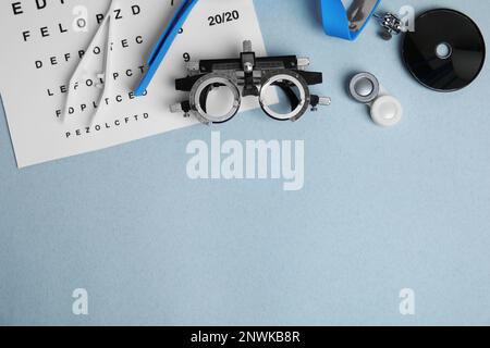 Different ophthalmologist tools on grey background, flat lay Stock ...