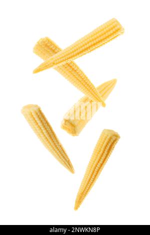 Tasty baby corn cobs flying on white background Stock Photo - Alamy