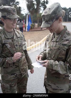 Command Sgt. Maj. Erin L. Hicks passes the U.S. Army Medical Activity ...