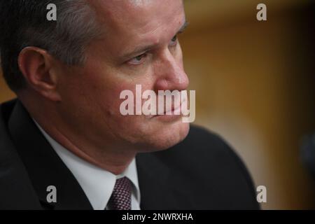 Michael J. Rourke, District Attorney for Weld County, listens to the ...