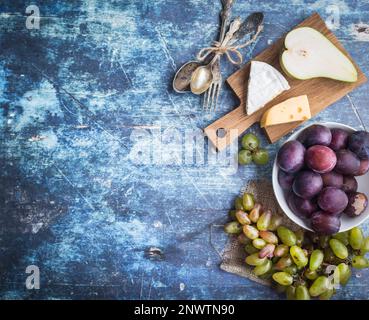 High angle view of assorted cheeses served with dry fruits Stock Photo ...