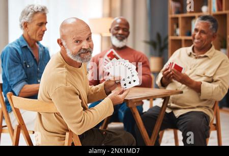 Group of friends relaxing and playing cards together. Young people ...