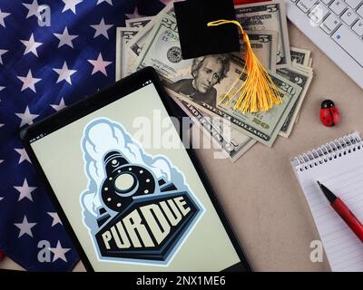 In this photo illustration, Purdue University logo seen displayed on a ...