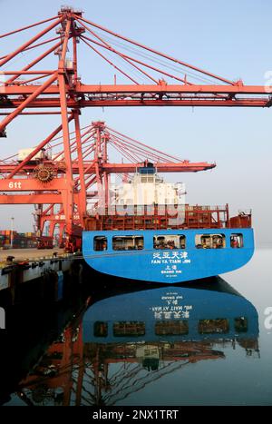 LIANYUNGANG, CHINA - FEBRUARY 1, 2023 - Ocean cargo ships load and ...