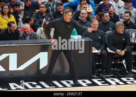 Minnesota Timberwolves coach Chris Finch talks to playeors during a ...