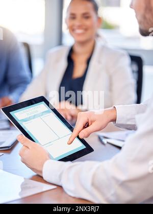 Creative business team holding a tablet Stock Photo - Alamy