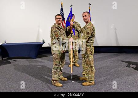 Col. Jason Dillon, 319th Operations Group commander, receives the ...