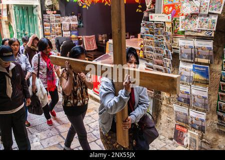 Pilgrims following Jesus' steps on the Via Dolorosa, in exterior of ...