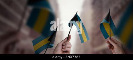 Hands Holding Flag of the Nation Bahamas Stock Photo - Alamy