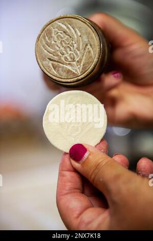 The making of traditional "Corzetti", a pasta typical from the Italian ...