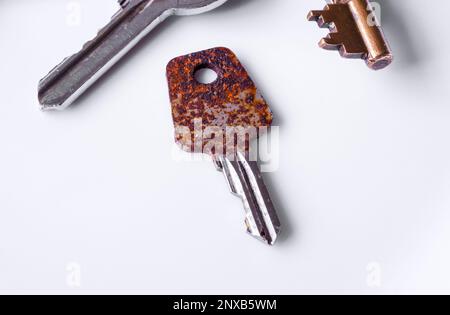 Small corroded key on white background 2 Stock Photo - Alamy