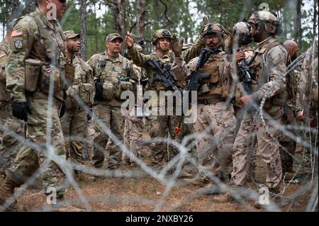 Staff Sgt. Humberto Cadena, U.S. Army 3rd Security Force Assistance Brigade Advisor, reviews ...