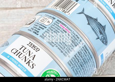 Cans of tinned Tesco Tuna chunks on a kitchen table. For UK food ...