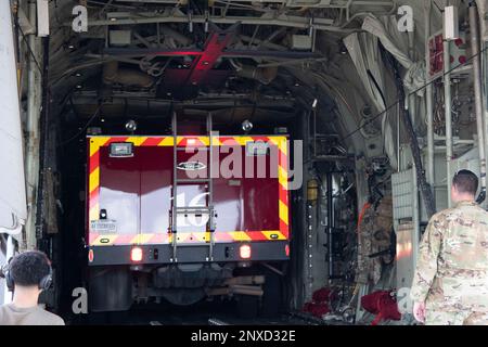 U.S. Airmen unload a P-34 Rapid Intervention Vehicle from a C-130J ...