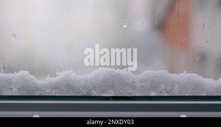 Frosted window with snow outside with sunrise background Stock Photo ...