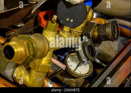 Waste with various components of an old heating system after renovation ...