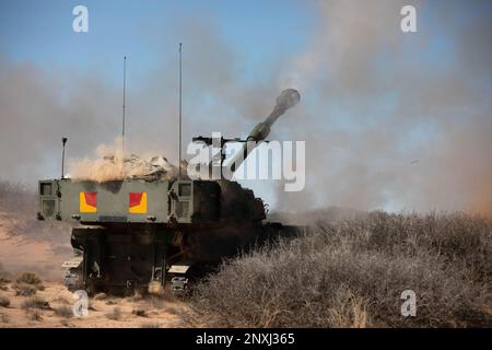 A self-propelled howitzer crew assigned to Bravo Battery, 4th Battalion ...