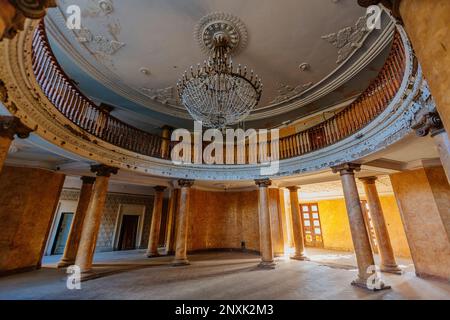 Entrance round hall with chandelier at the abandoned palace Stock Photo ...