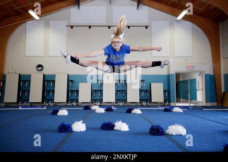 The Wahconah Regional High School cheerleading team practices a stunt ...