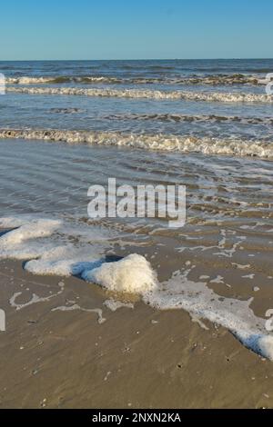 Sea foam or spume washing up on a beach. No people Stock Photo - Alamy