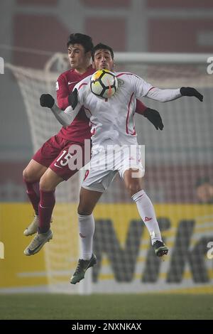 Oday Ibrahim Mohammad Dabbagh of Palestine, left, kicks the ball to ...