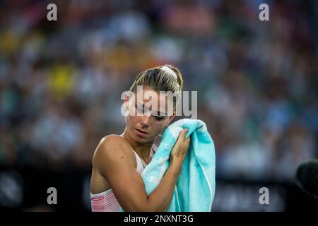 Camila Giorgi of Italy wipes the sweat from her face during her third ...