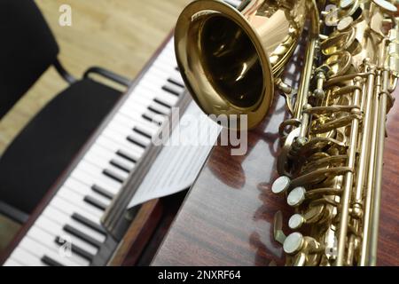 Piano and saxophone, closeup Stock Photo - Alamy