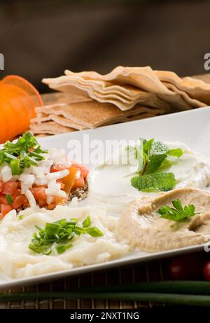 hommos, labneh, chancliche, garlic paste, arab food Stock Photo - Alamy