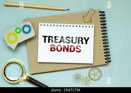 Papers with text, treasury bonds on a table, business concept Stock ...