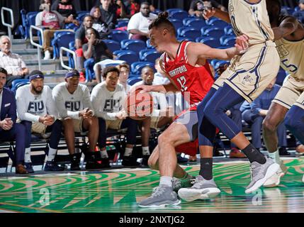 Hartford guard Jason Dunne (12) drives into Mississippi State guard ...