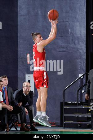 Hartford guard Jason Dunne (12) drives into Mississippi State guard ...