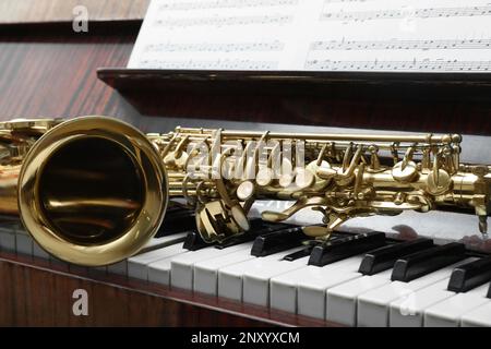 Piano and saxophone, closeup Stock Photo - Alamy