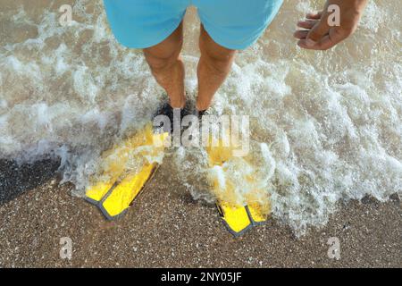 Top view of a man swimming with flippers in Rasdhoo Island, The ...