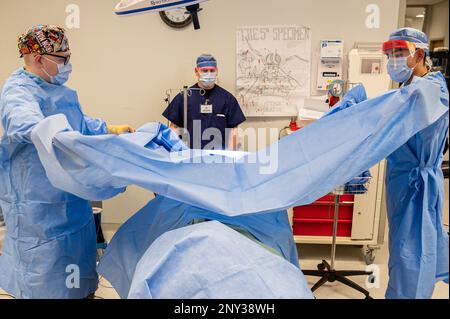 Instructors act as surgeons during a mock surgery while 68D operating ...