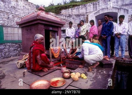 People praying pooja at Brahma Kundica Moola Cauvery in Talacauvery ...