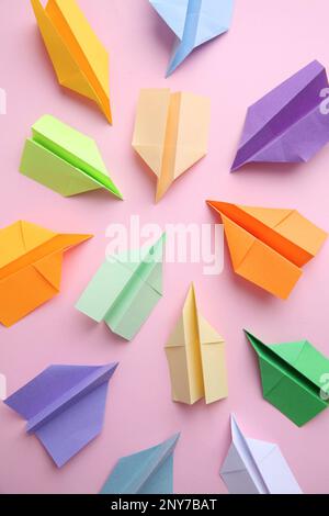 Many paper planes on colorful background Stock Photo - Alamy