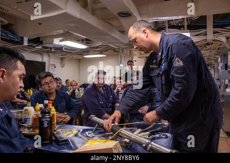 SINGAPORE (Feb. 23, 2023) – Damage Controlman 2nd Class Eli Johnson ...