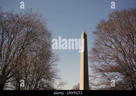 A simple typical monolith obelisk standing in the meadow in a black and ...