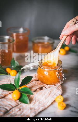 Glass jar with tasty fig jam isolated on white background, closeup ...