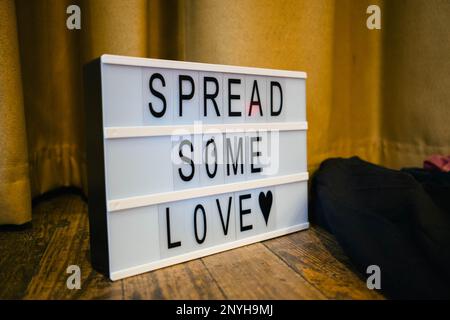 Spread message of love concept. Two white dove origami carrying word ...