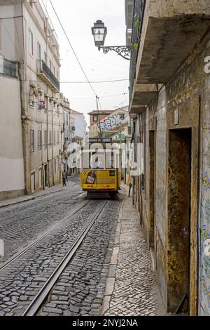 Historic tram line 28 passing through the streets of Lisbon/Portugal ...