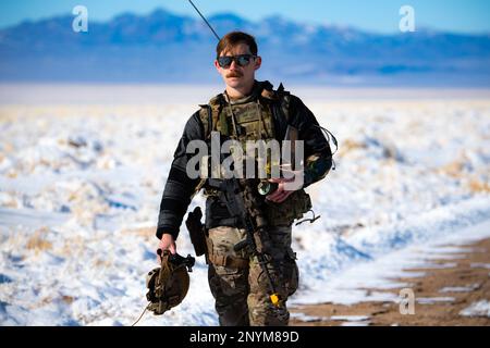 Technical Sergeant Aaron Kostiuk, 822d Base Defense Squadron, directs ...
