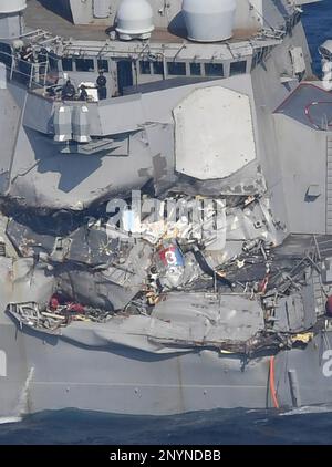 An aerial photo shows the USS Fitzgerald that is damaged by the ...