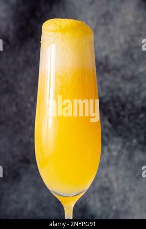 Flute Glass of Mango Mimosa cocktail on gray background Stock Photo - Alamy