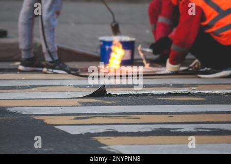 Process of making new road surface markings with a line striping ...