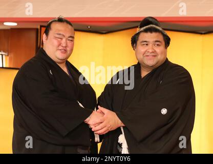 Sumo wrestler Takayasu (R) , shakes hands with yokozuna Kisensato after ...