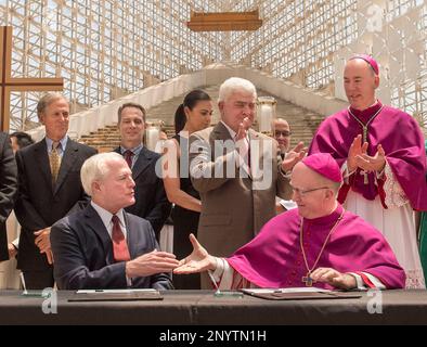 Bishop Kevin Vann, left, and John Rochford, right, president and COO of ...