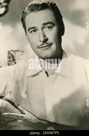 American actor Errol Flynn in the movie The Warriors, 1955 Stock Photo ...