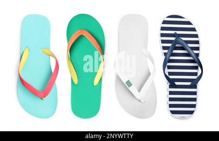 Set with different flip flops on white background, top view. Banner ...