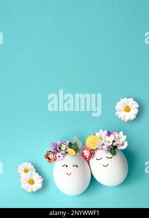 Two Easter eggs with funny faces and gray crocheted hats with bunny ...